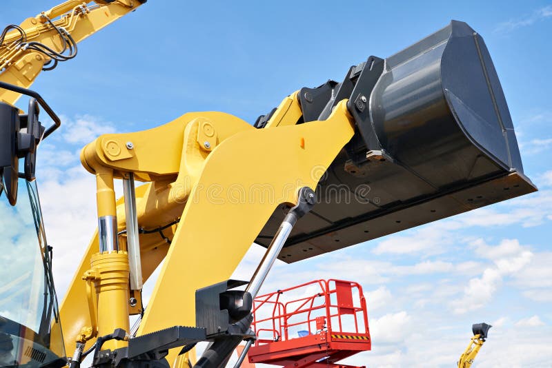 Front loader buckets stock image. Image of heavy, lift - 323856849