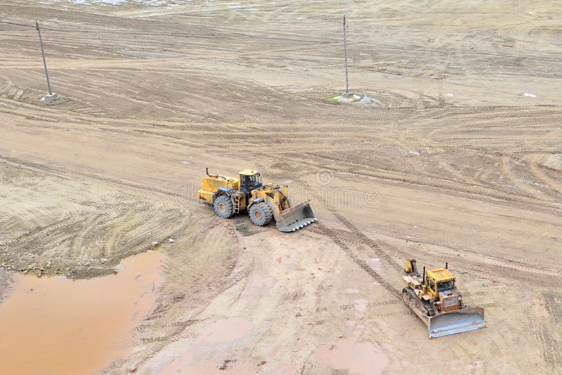 Front-end Loader Working in Open Pit. Earth-moving Heavy Equipment for ...