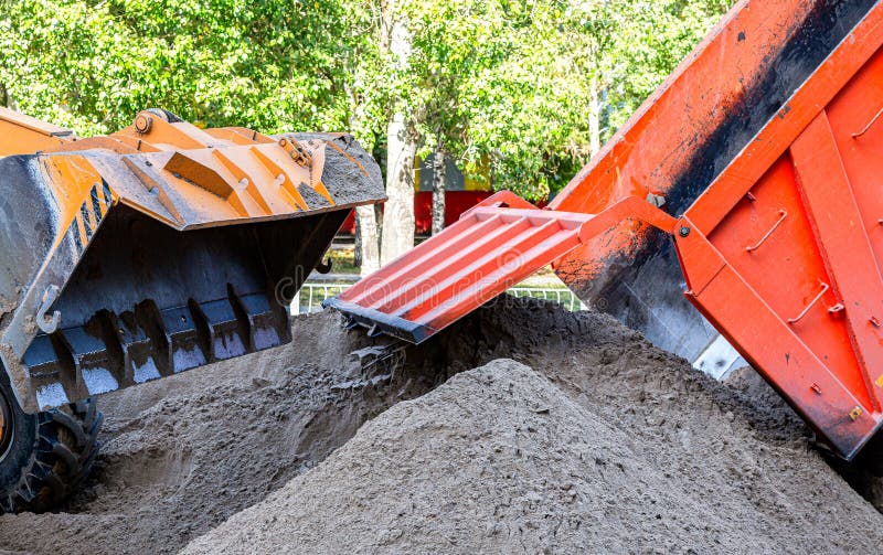 Front Loader and Dump Truck Unload Sand Stock Image - Image of ...