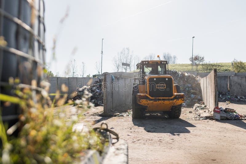 Front End Loader Moving Along Recycling Center Area, Close Up View ...