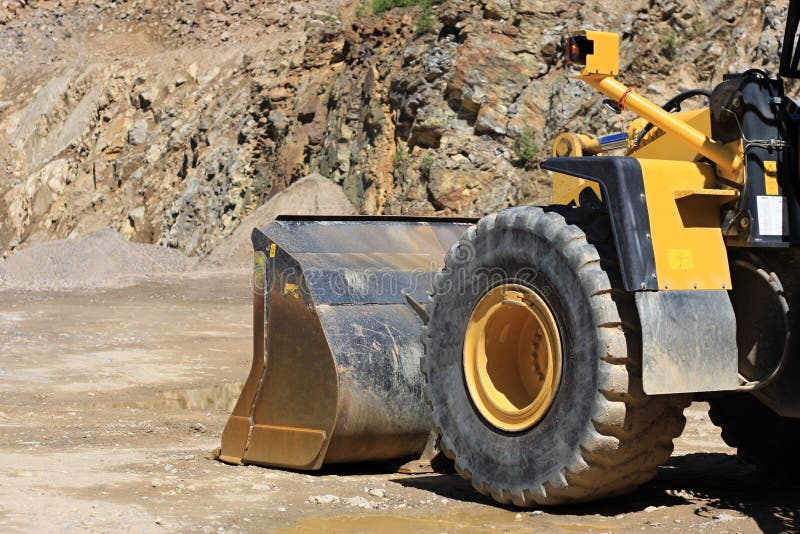 Front loaders in quarry stock photo. Image of loader, quarry - 9773582