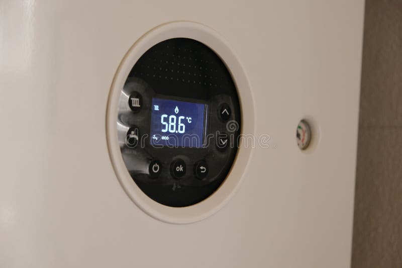 Front Panel of Gas Combi Boiler with 58,6 Celsius and Eco Sign on the ...
