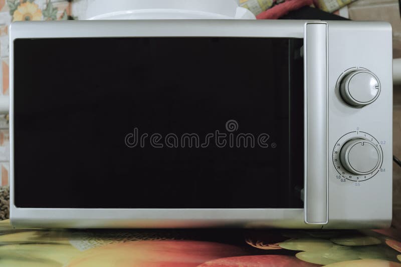 Front Panel of a Microwave Oven with a Handle on the Door Stock Photo ...