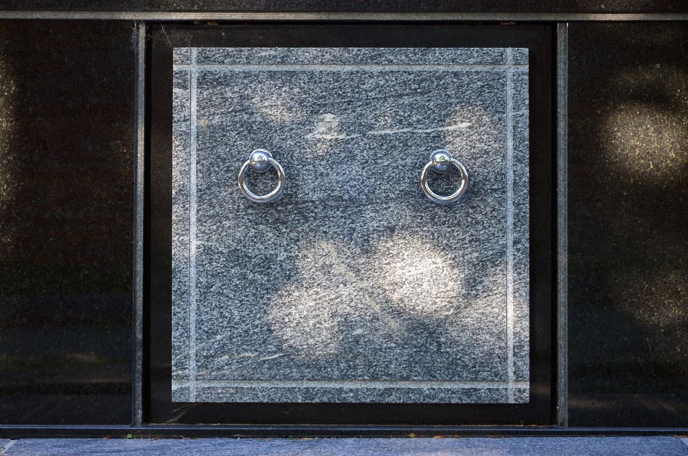 The Front Part of the Granite Crypt with Metal Ring Handles in the ...