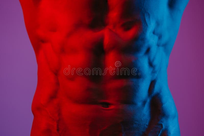 A Front Photo of the Abs of a Bodybuilder Under Blue and Red Lights ...