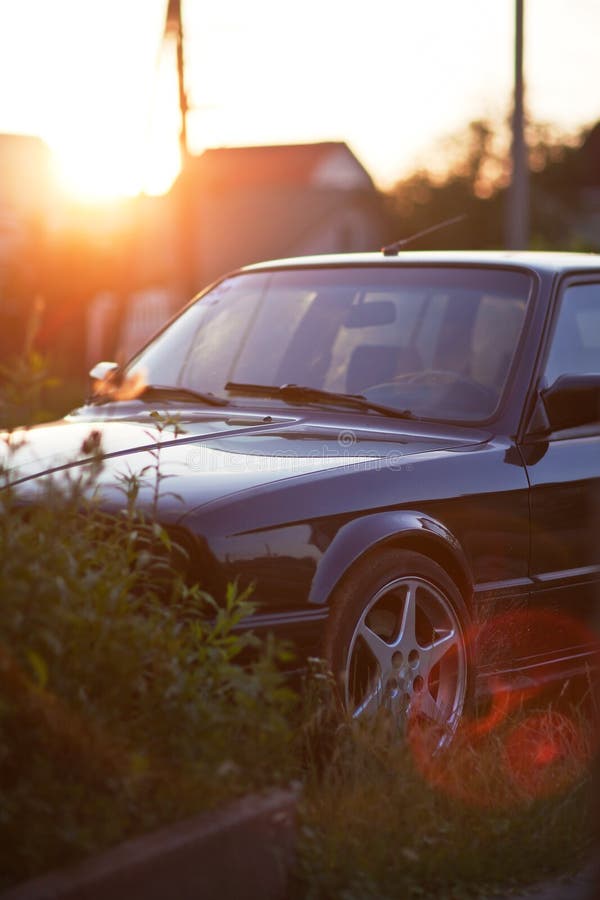 Front Side of Black Old Car with Beatifull Sunset Stock Image - Image ...