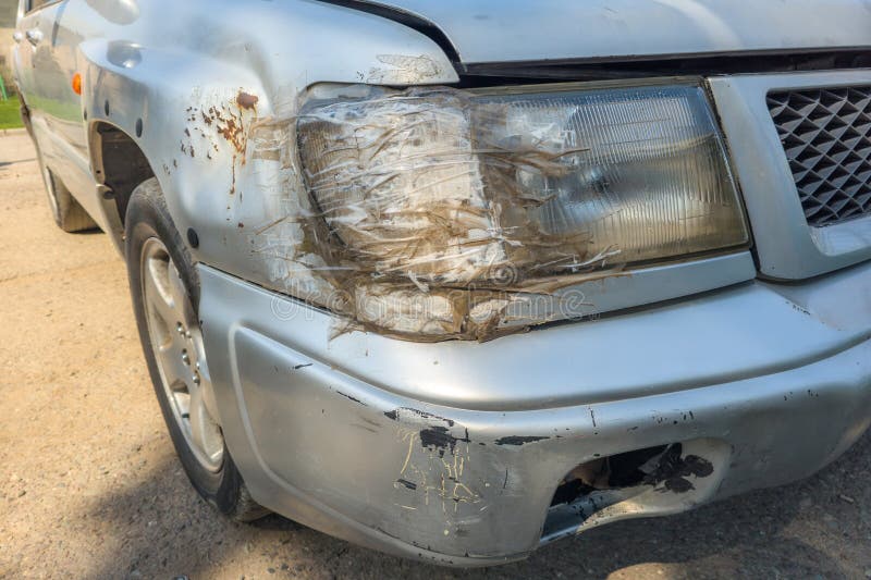 Front Side of an Old Damaged Silver Vehicle Headlamp Fixed with Clear ...