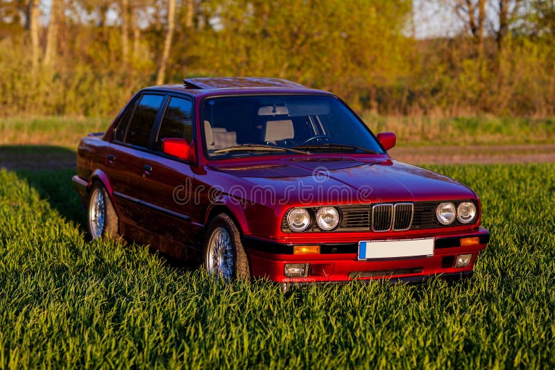 Front Side of an Old German Car that Stands on Green Grass at Sunset ...