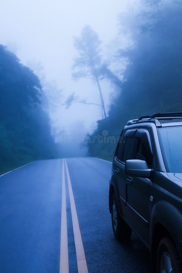 SUV Car on a Mountain Road in the Mist Stock Photo - Image of line ...