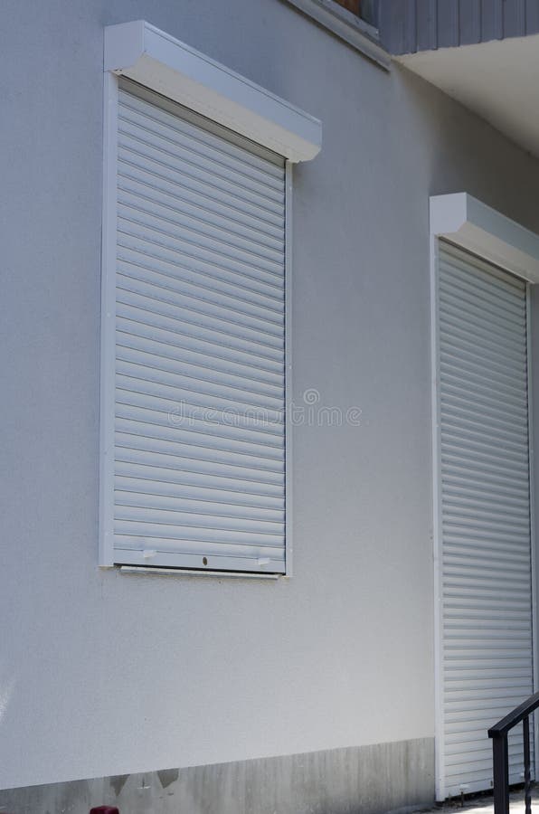 Front of the Store with Closed White Roller Shutters Stock Photo ...