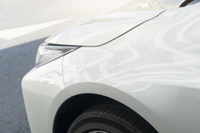 Front Tilt Angle of White Car on the Ashpalt Road with Sunlight at ...