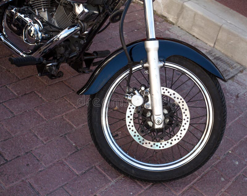 The Front Tire of a Parked Custom Motorcycle Stock Photo - Image of ...
