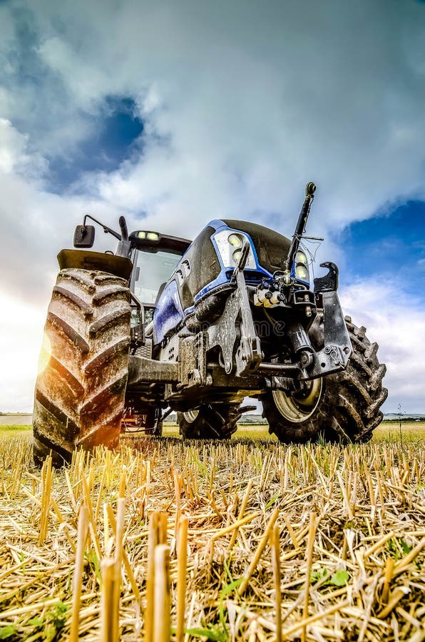 Tractor Equipped with a Trailer for Stacks of Straw Close-up Stock ...