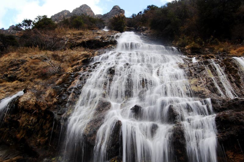 In Front of Us is a Beautiful White Waterfall Flowing Down the Mountain ...