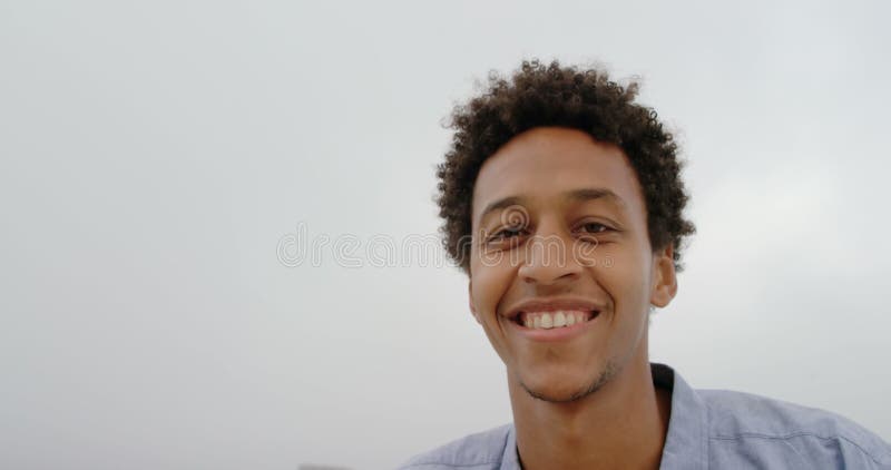 Front View of African American Man Standing on the Beach Stock Photo ...