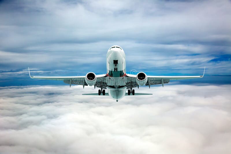 Front View of Passenger Plane Flies High Above the Clouds Stock Image ...