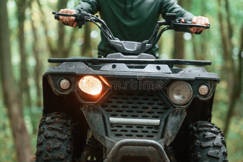 Front View. ATV Driver is in the Forest, Having a Ride at Daytime Stock ...