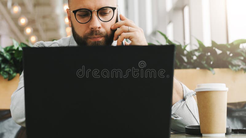 Front View. Bearded Businessman is Sitting in Office at Table in Front ...