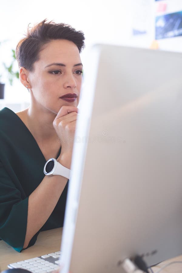 Female Executive Working on Computer at Desk Stock Image - Image of ...