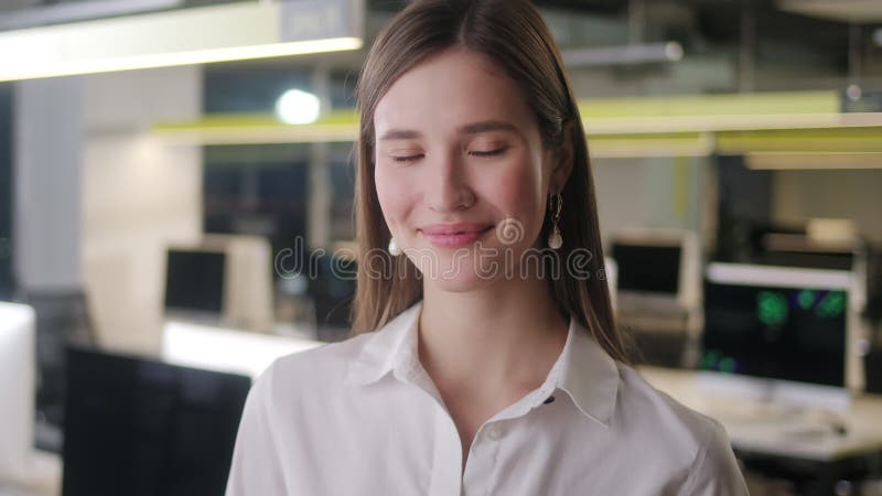 Portrait Of Beautiful Young Woman Wearing White Shirt Looking Up To The