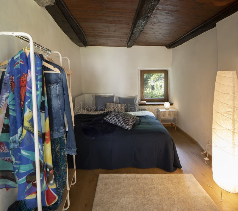 Front View Bedroom with Double Bed, Bedside Table with a Lamp Above and ...