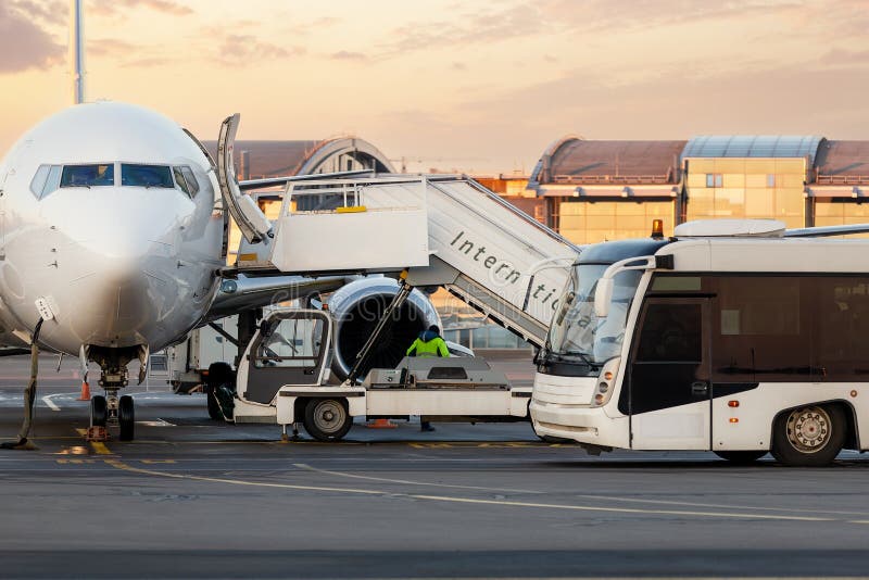 Front View Big Modern Passenger Aircraft Approach Boarding Witth Stairs ... Front View Big Modern Passenger Aircraft Approach Boarding Witth Stairs ...
