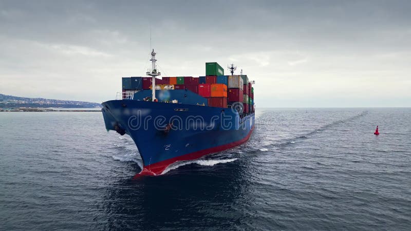 Front View of a Blue Container Ship Sailing through Calm Waters Under a ...