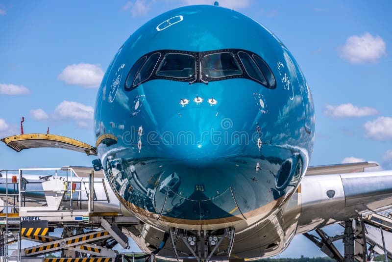 Front View of a Blue Jet Plane with a Blue Sky in the Background. a ...