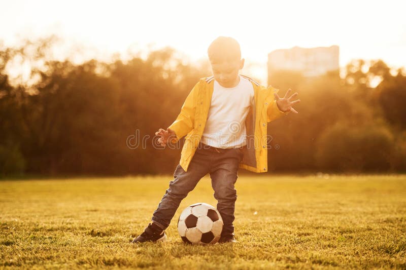 Red Colored Toy Plane. Little Boy is Playing on the Summer Field Stock ...