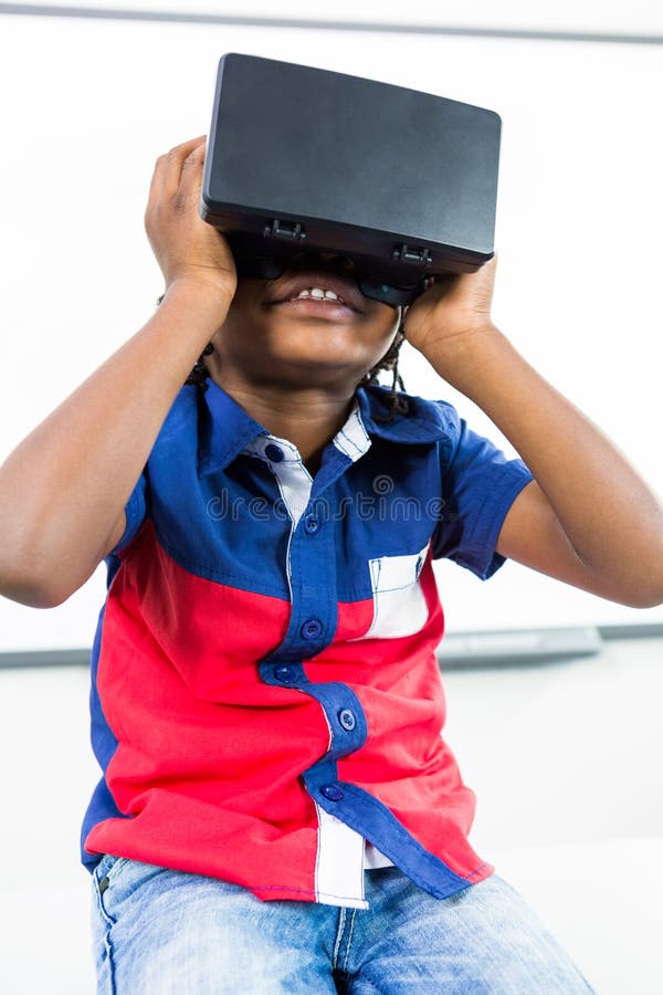 Front View of Boy Using Virtual Reality Headset in Classroom Stock ...