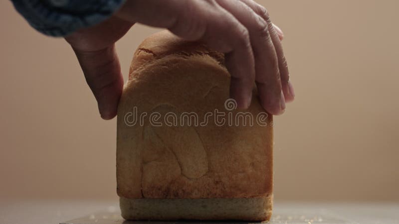 Front View of Brick of Bread. Mans Hand Take Off a Front Part of Bread ...