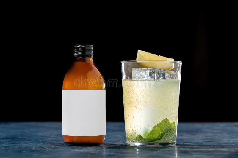 Front View of Brown Bottle and Refreshing Cocktail on Blue Surface ...