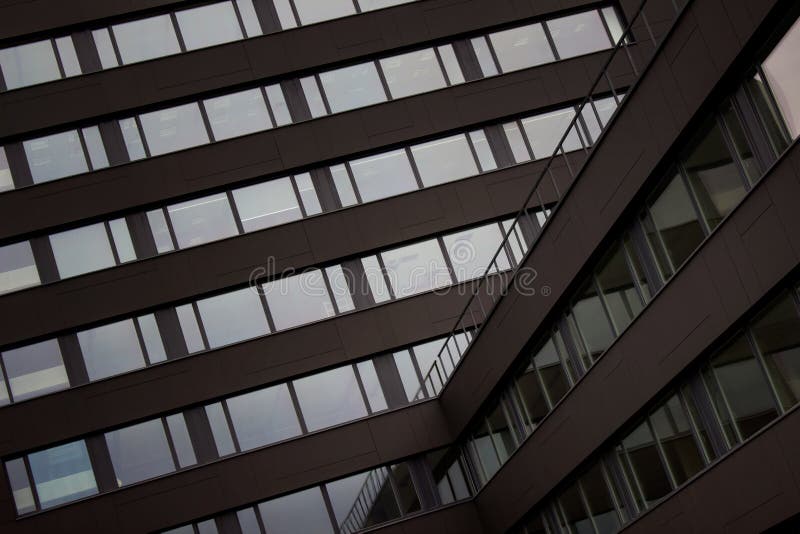 Front View of Brown Office Building with Large Reflective Windows ...