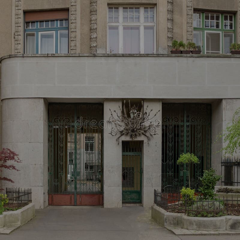 Front View of a Building with Gates and Green Plants Stock Photo ...