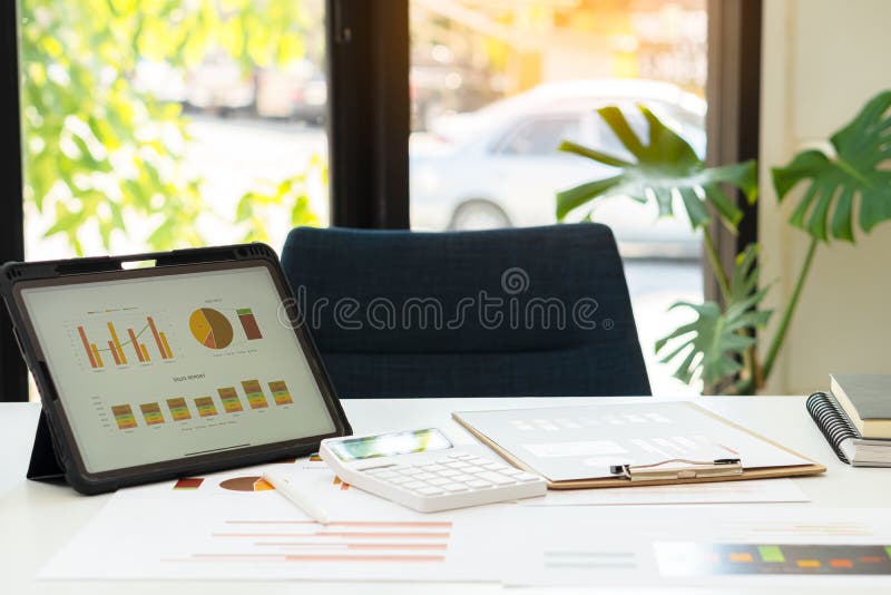 Front View on Business Desk with Laptop Computer and Graph Document ...