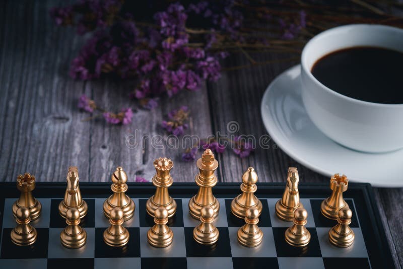 Front View of a Chess Game on a Chessboard with a White Coffee Cup Blur ...