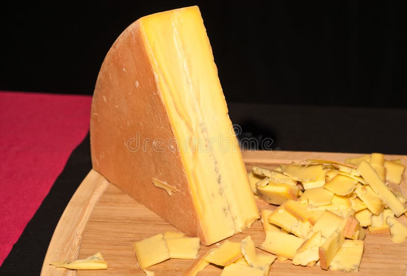 Quarter Cheddar Cheese Wheel on a Wood Serving Board with Sample Stock ...
