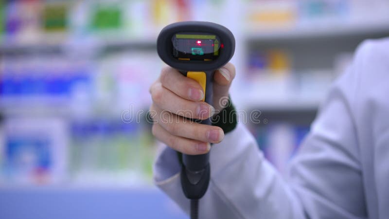 Front View Close-up Bar Code Reader in Female Hand with Red Light ...