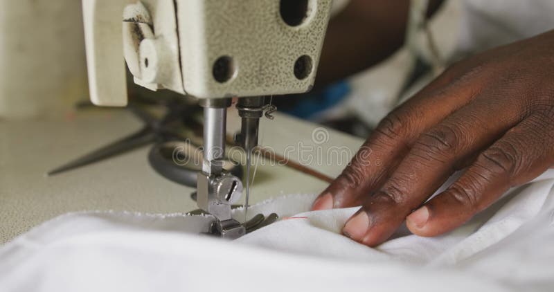 African man sewing tissue stock video. Video of handmade - 171073781