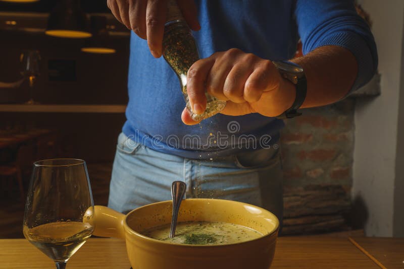 Front View Close Up on Hands of Unknown Man Adding Pepper or Other ...