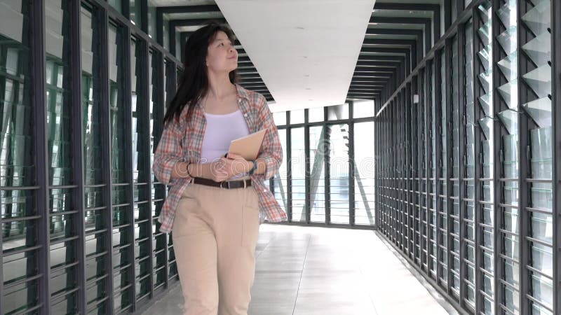 Back View of College Female Student Walking in Building Campus Corridor ... Back View of College Female Student Walking in Building Campus Corridor ...