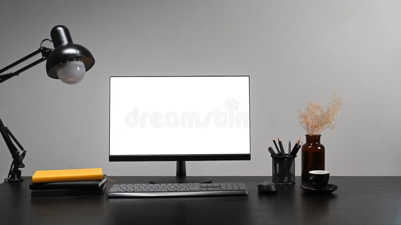 Computer with White Screen, Books, Pencil Holder and Lamp on Black ...