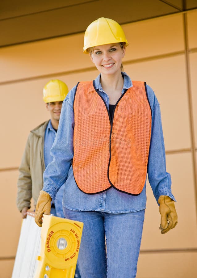 Front View of Construction Workers Carrying Ladder Stock Photo - Image ...