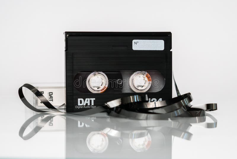 Front View of a DAT Cassette with a Box and a Twisted Tape Stands ...