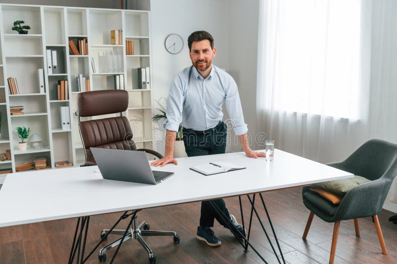 Front View. Doctor in Formal Clothes is Working in the Cabinet Stock ...