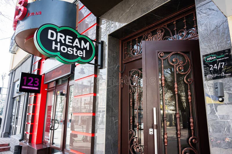 Front View of Dream Hostel Entrance with Vibrant Signage and Doors ...