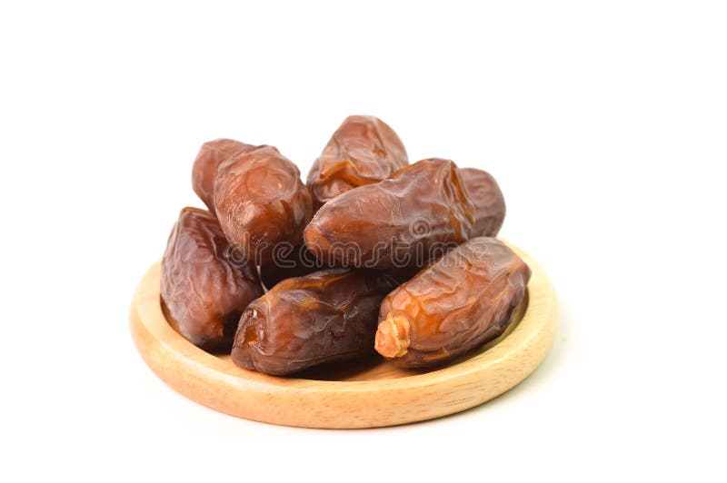 Front View of Dried Dates or Kurma on Wooden Plate Isolated on a White ...