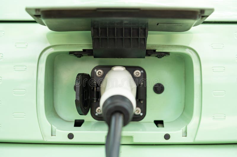 Front View of an Electrical Car Being Charged at Horizontal Composition ...