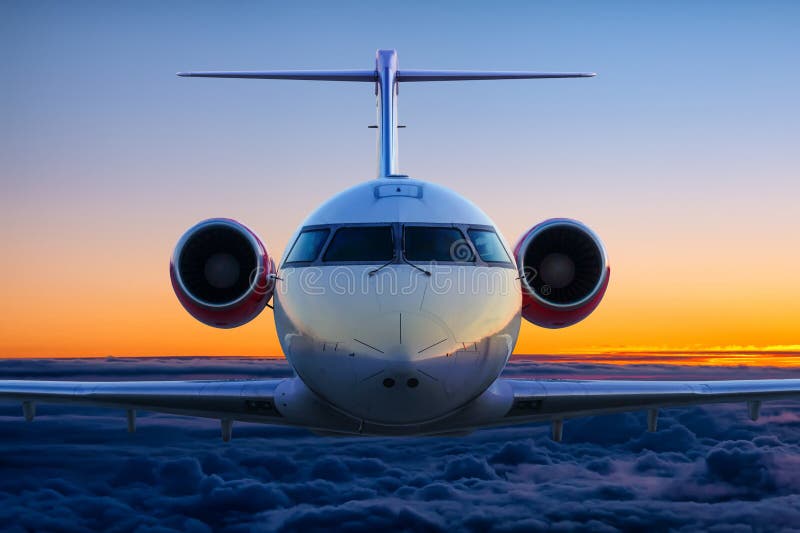 Front View of the Executive Airplane Flies in the Sunset Sky Stock ...