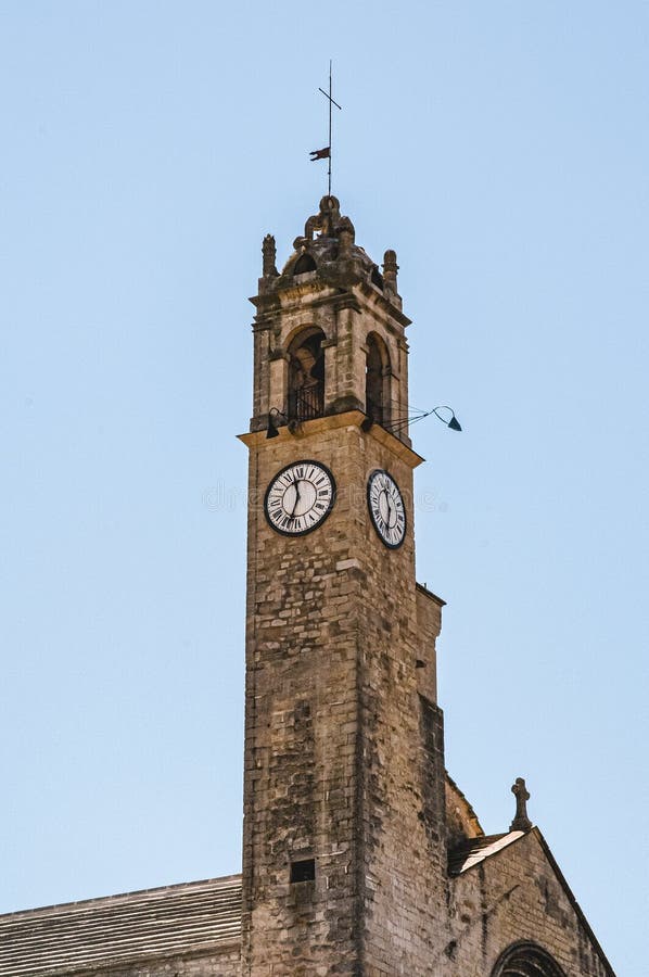 Clock and Bell Tower with a Light, Blue Sky Background Stock Photo ...